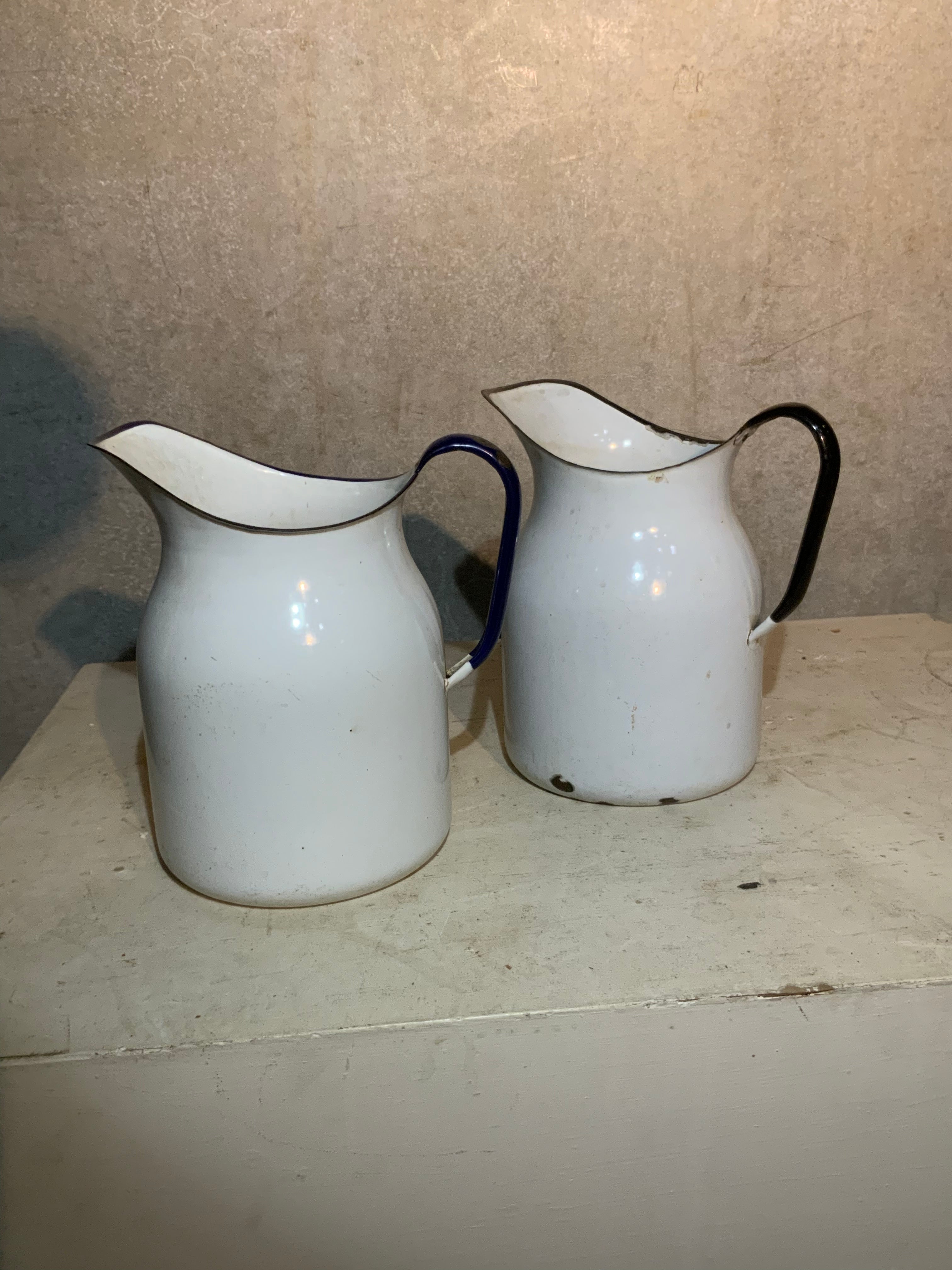 Pair 1920 enamel water pitchers